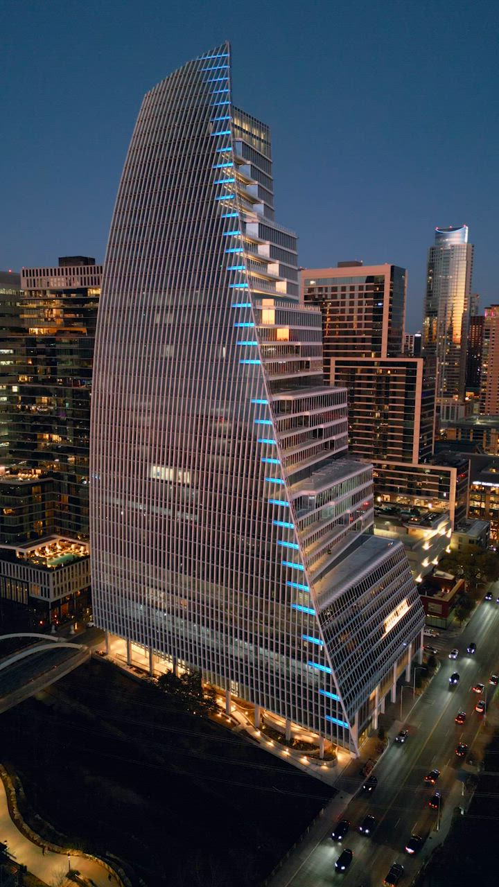 Modern building in an aerial shot at dusk - Free Stock Video