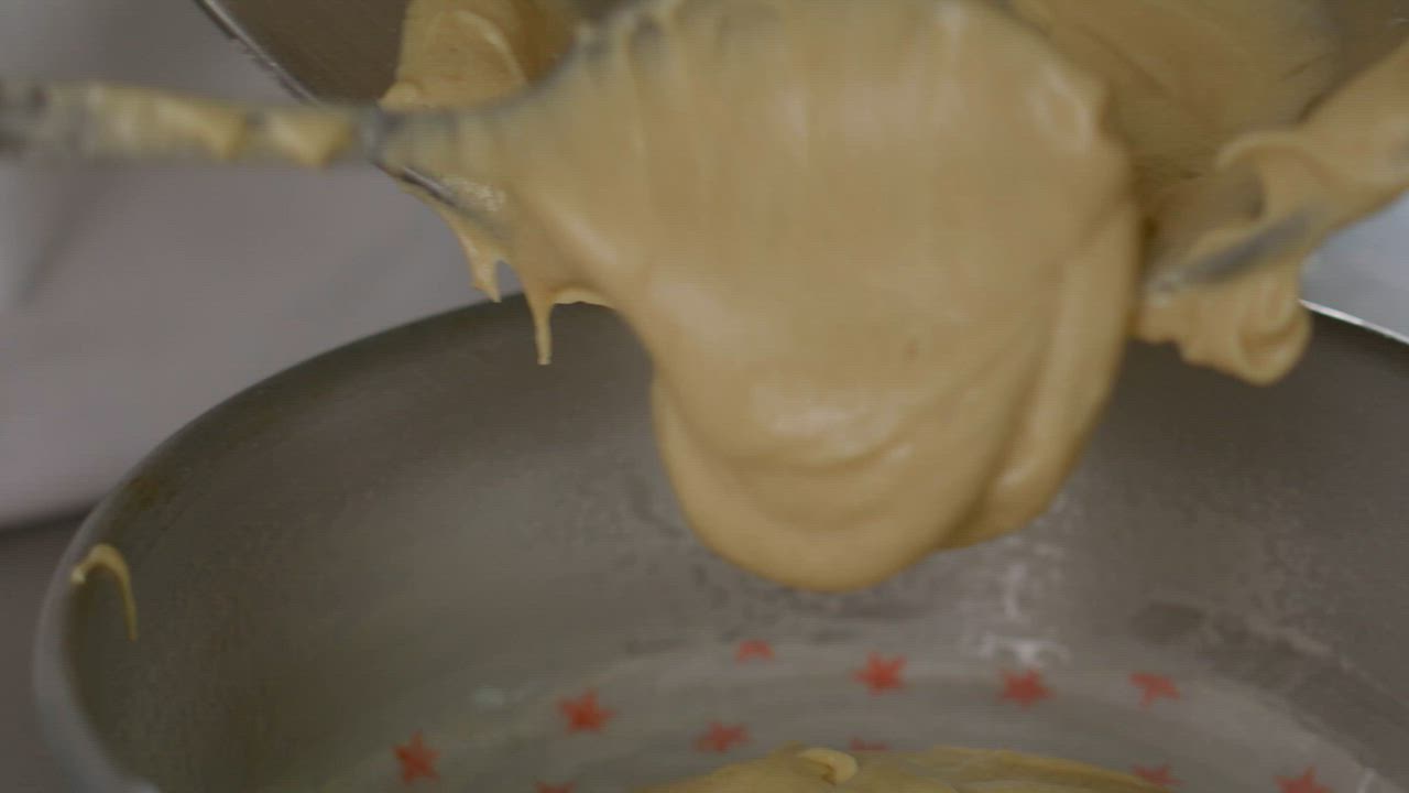 Pastry chef pouring cake mix into baking pans - Free Stock Video