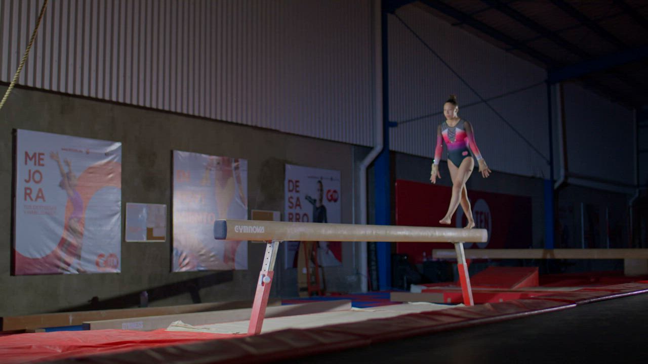Complex acrobatics made by a young gymnast - Free Stock Video