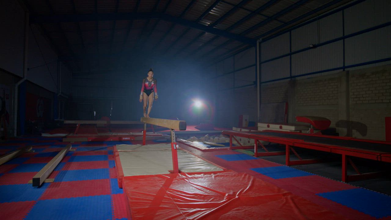 Talented gymnast doing a complex acrobatics - Free Stock Video