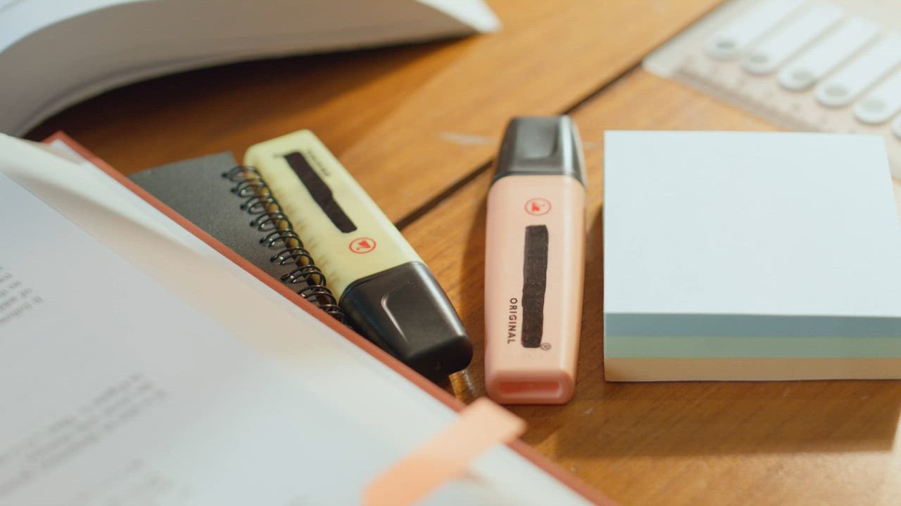 Student hand takes a stiky note to paste it on the notebook - Free ...