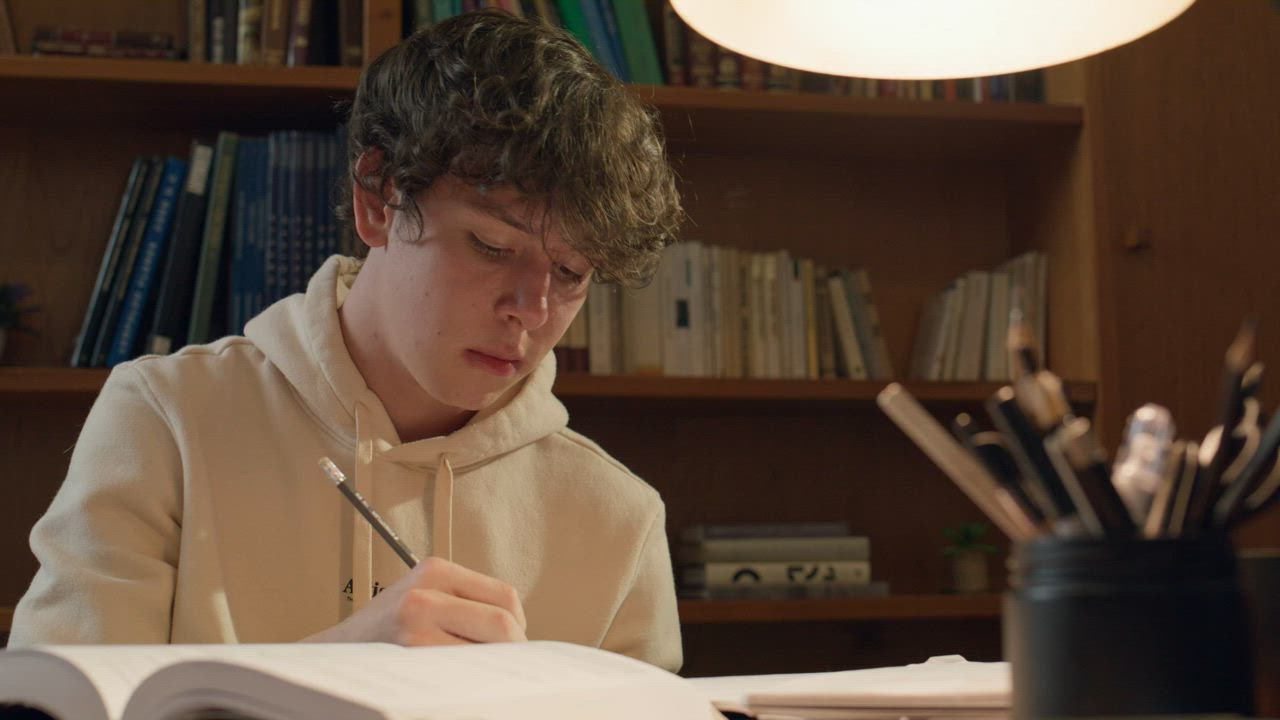 Student receiving instructions and help form his professor in the ...