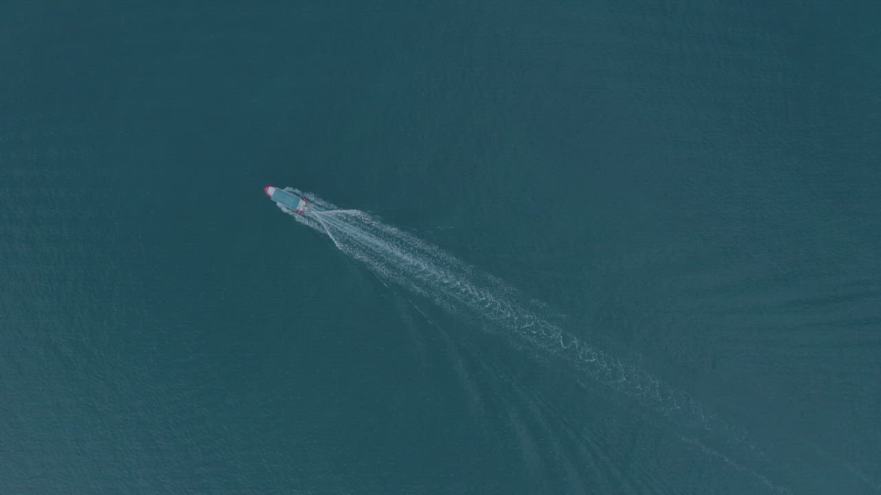 Boat sailing in the sea seen from high above - Free Stock Video