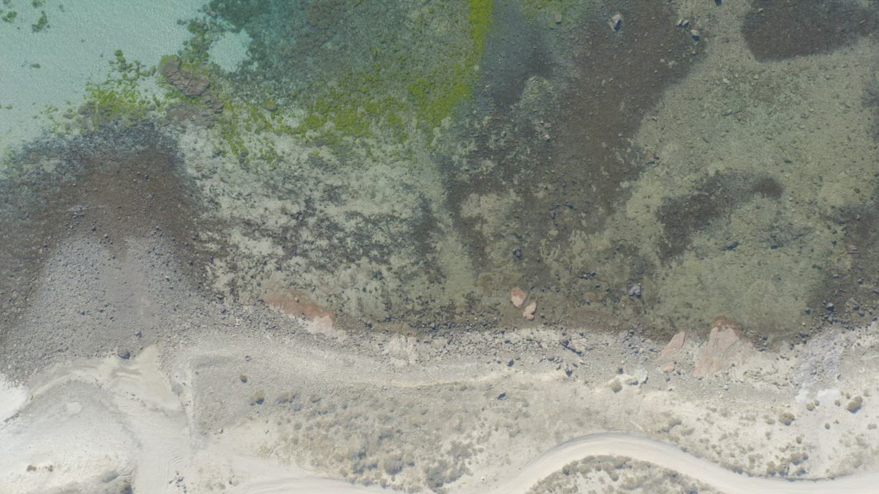 Edge of a coast from an overhead aerial view - Free Stock Video