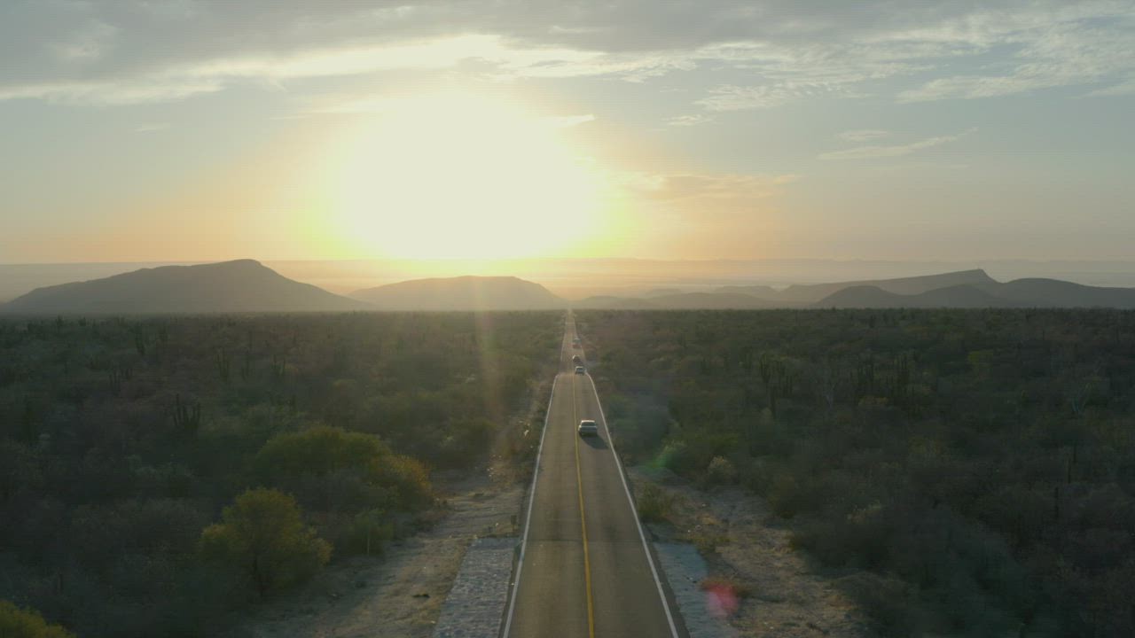 Aerial landscape around a highway at sunset - Free Stock Video