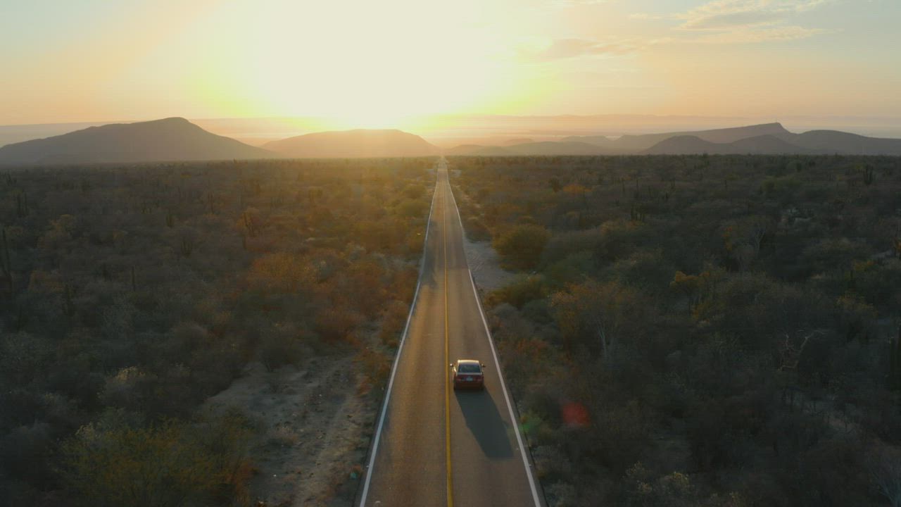 Natural landscape with a road at sunset - Free Stock Video