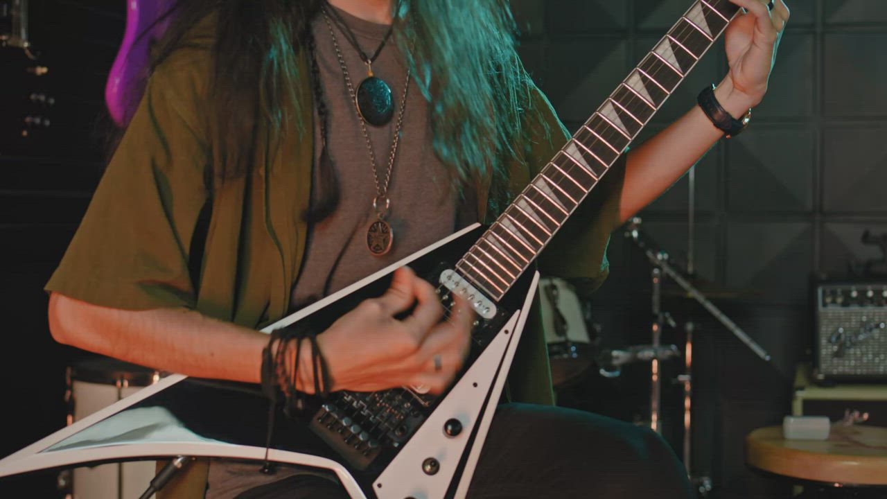 Metal Guitarist's Skillful Music Store Performance - Free Stock Video