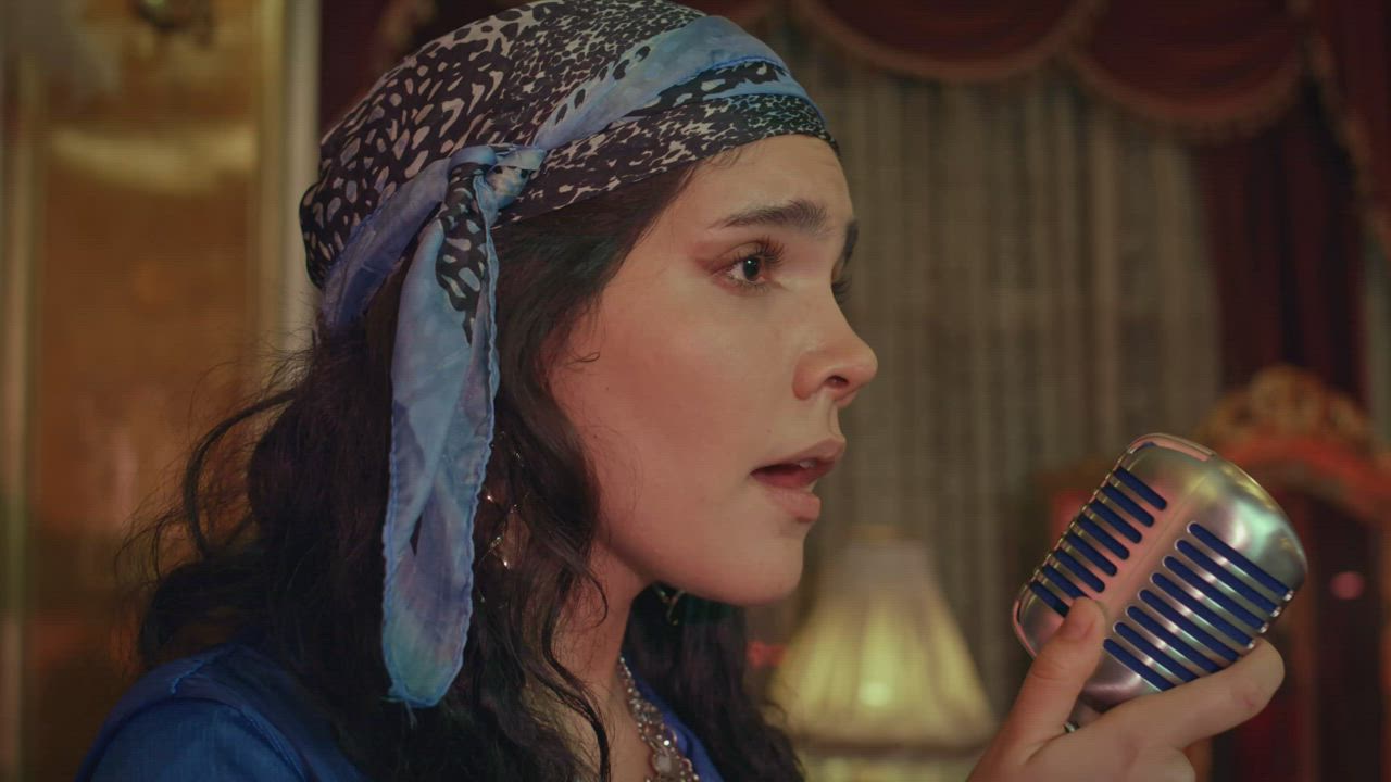 Face of a singing girl in a fancy old place - Free Stock Video