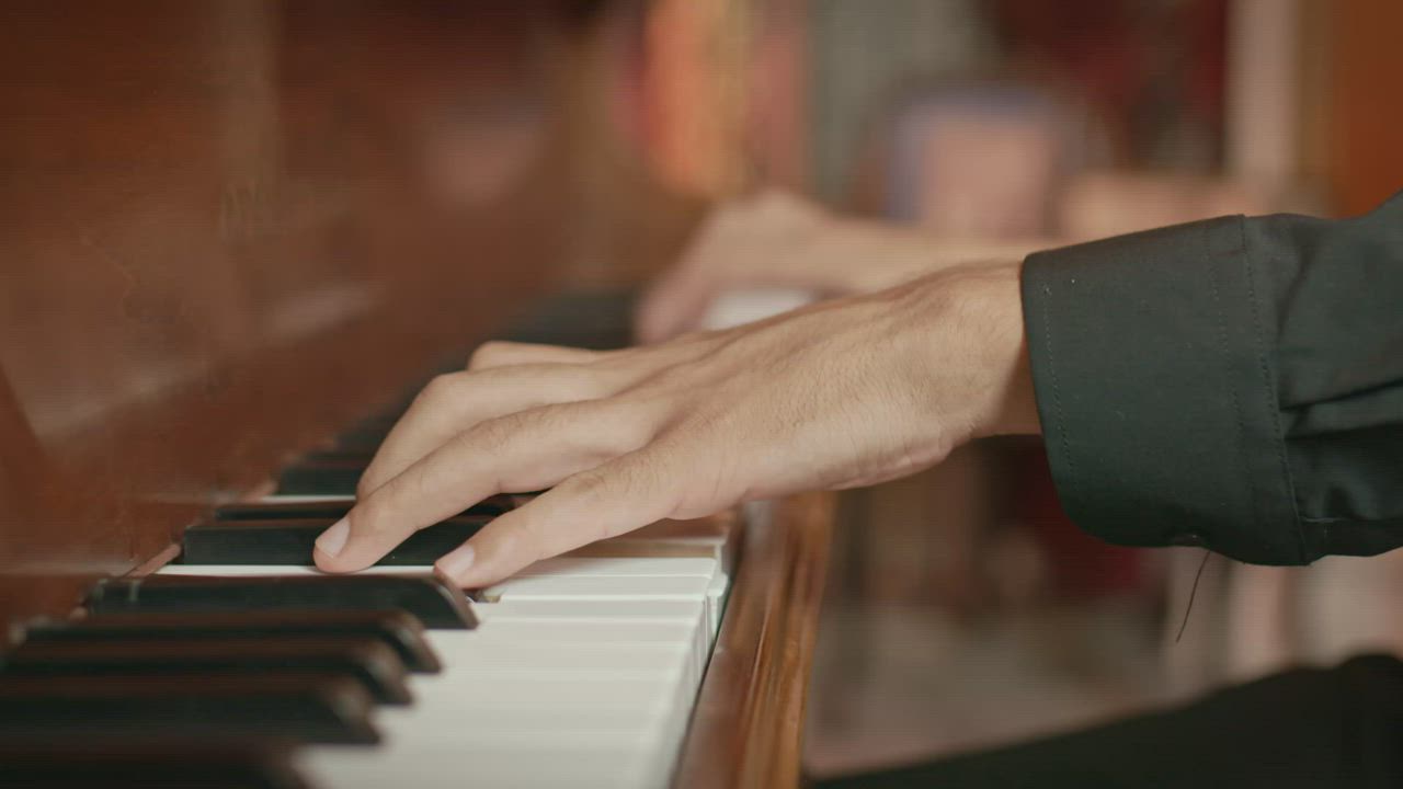 Hands of a skillful musician playing a wooden piano - Free Stock Video