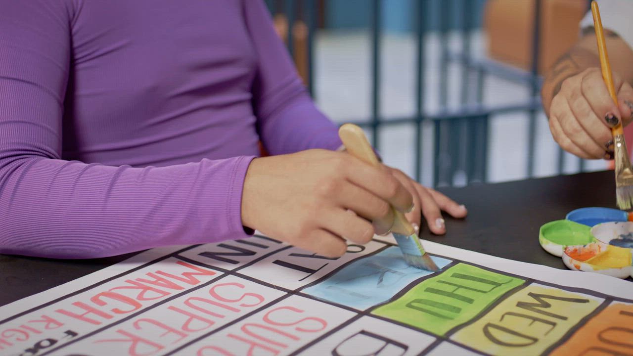 Close up of someone filling in a Pride poster for Pride Day - Free ...
