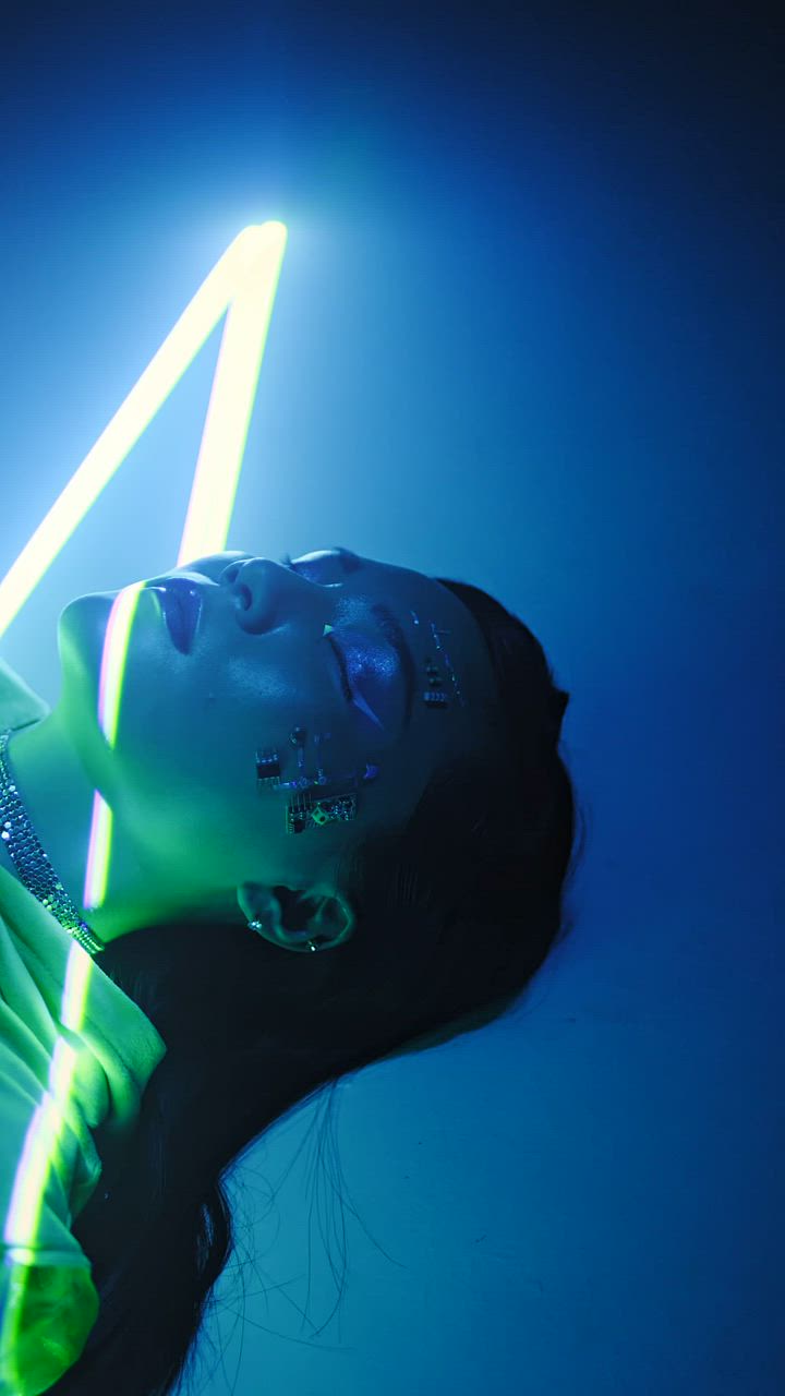 Close up vertical video of a dancer under neon lights - Free Stock Video