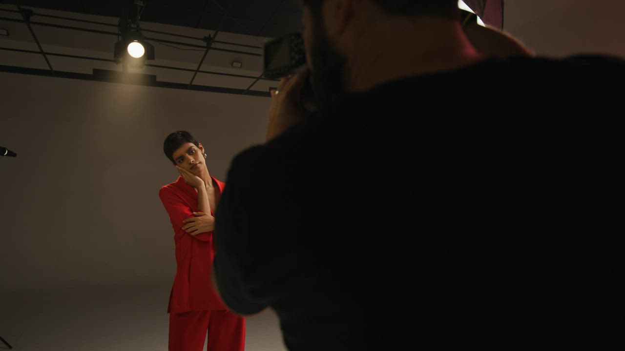 View from behind a photographer during a fashion shoot - Free Stock Video