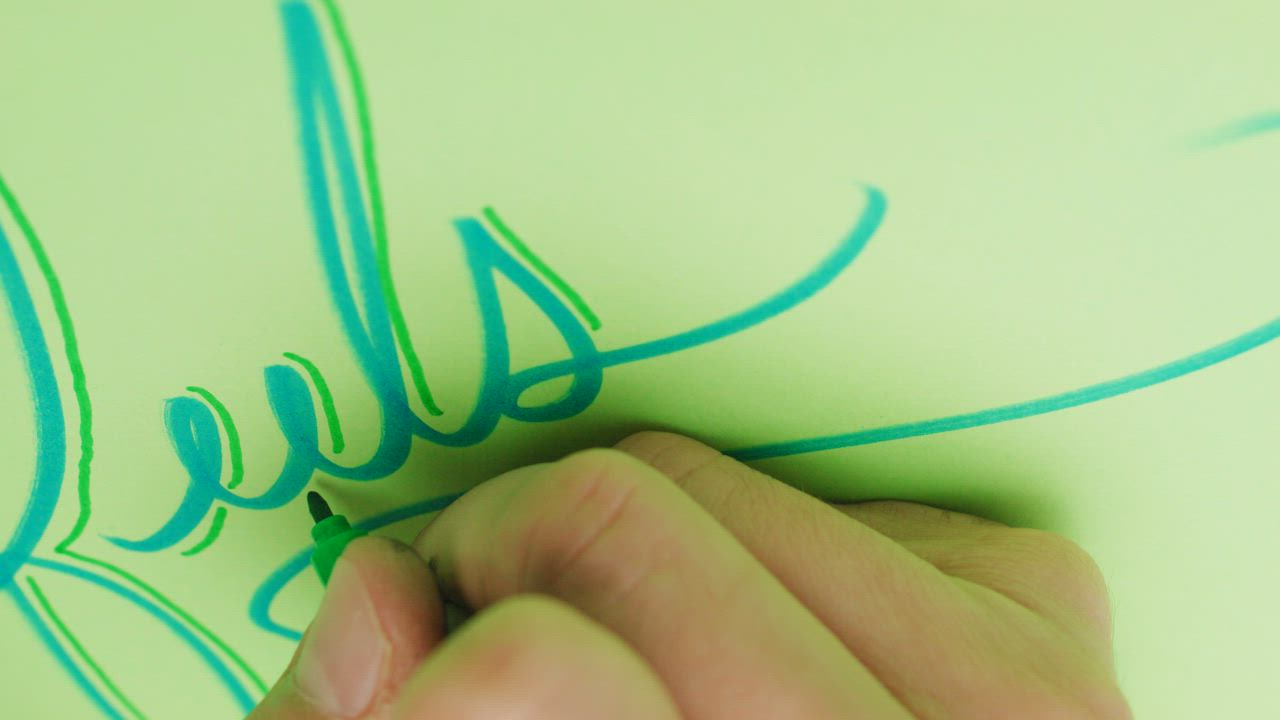 Close up of calligrapher adding details to the word Feels - Free Stock ...