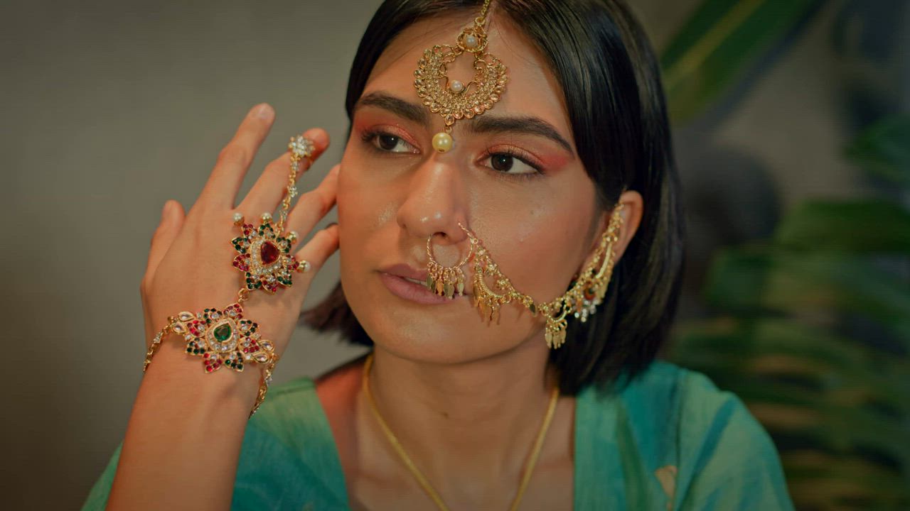 Indian woman with exotic face jewelry strikes a pose - Free Stock Video