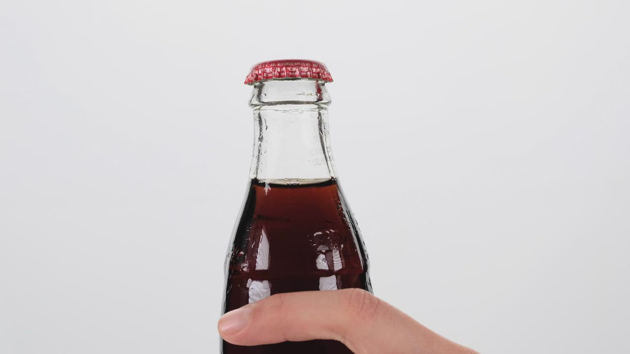 Opening a bottle of cola - Free Stock Video
