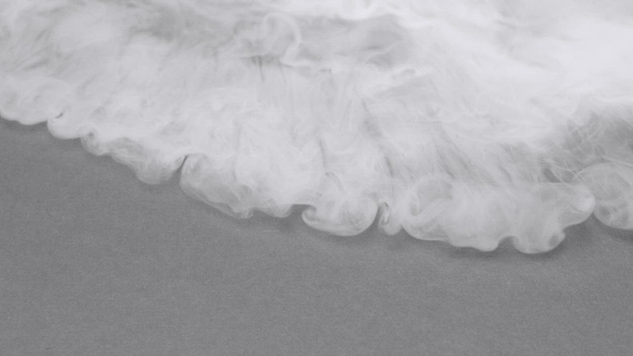An ethereal white mist mas waves as it falls - Free Stock Video