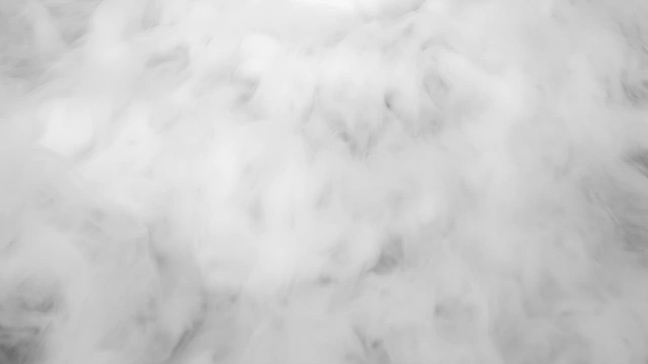 The white mist rapidly travels over a white backgorund - Free Stock Video