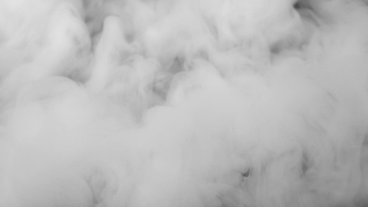 A thick mist abundantly flows from top to bottom - Free Stock Video