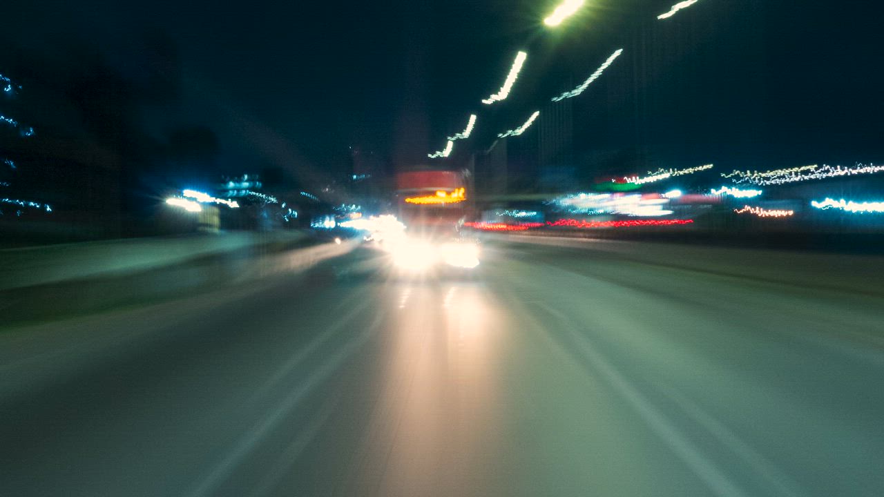 Timelapse of a drive through the city streets at night - Free Stock Video
