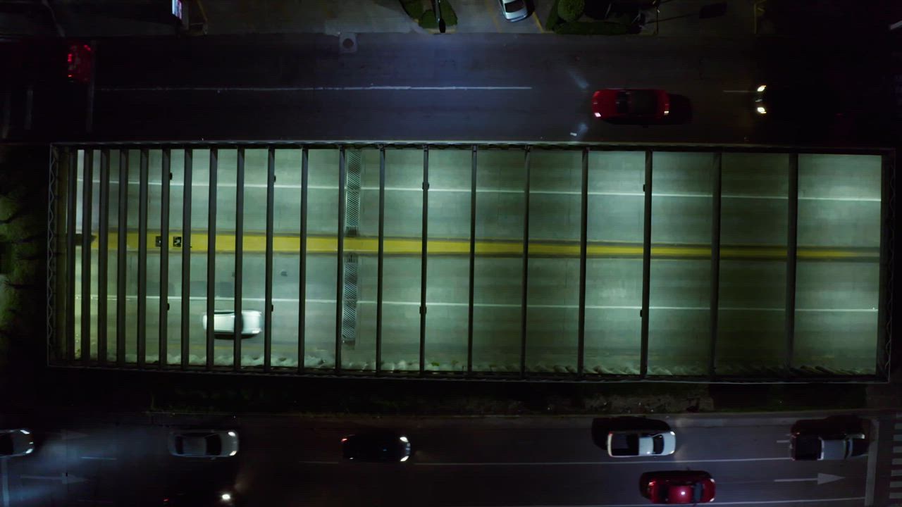 Zoom out aerial view of a city road intersection - Free Stock Video