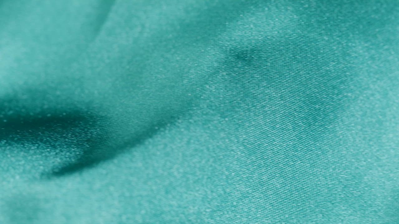 Extreme close up of the texture of an emerald fabric - Free Stock Video