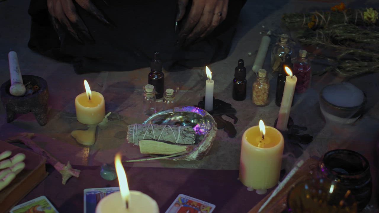 An eerie creature creating a potion on a mortar - Free Stock Video