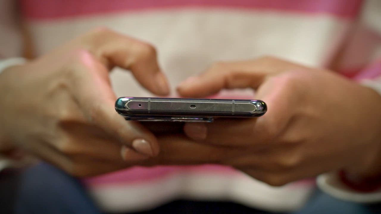 Close up of a woman's hands texting - Free Stock Video