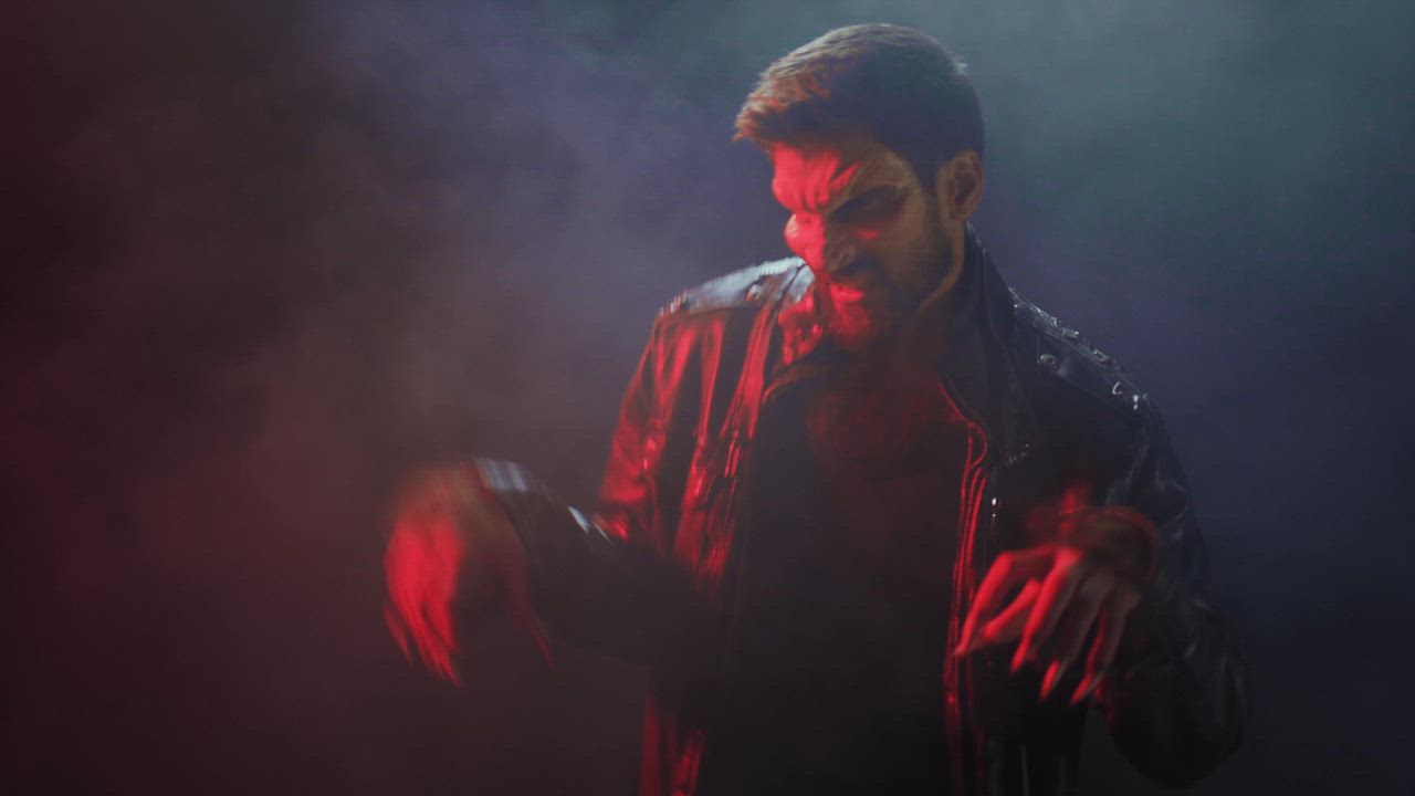 A scary werewolf wearing a leather jacket looking for prey in the ...