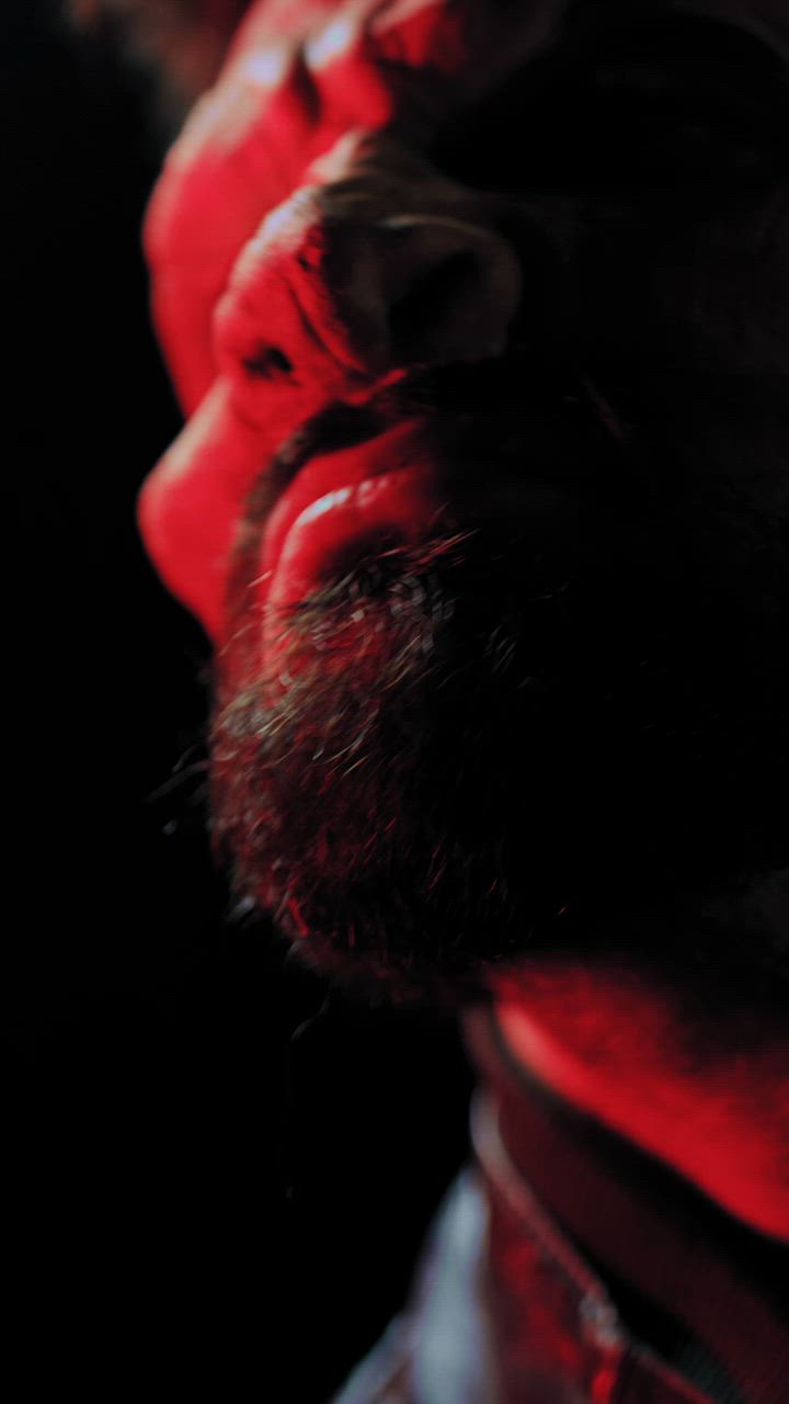 A spooky werewolf looks at the camera in a menacing way - Free Stock Video