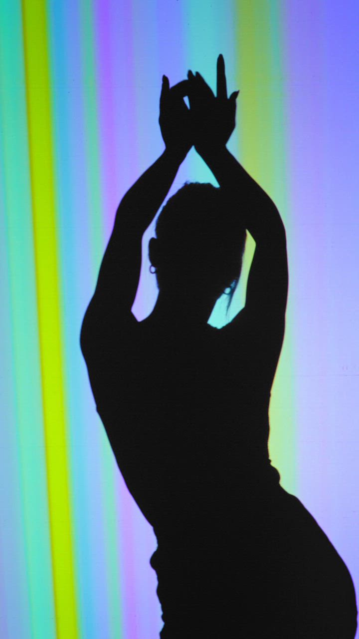 Silhouette of a dancer in a performance on a colorful background - Free ...