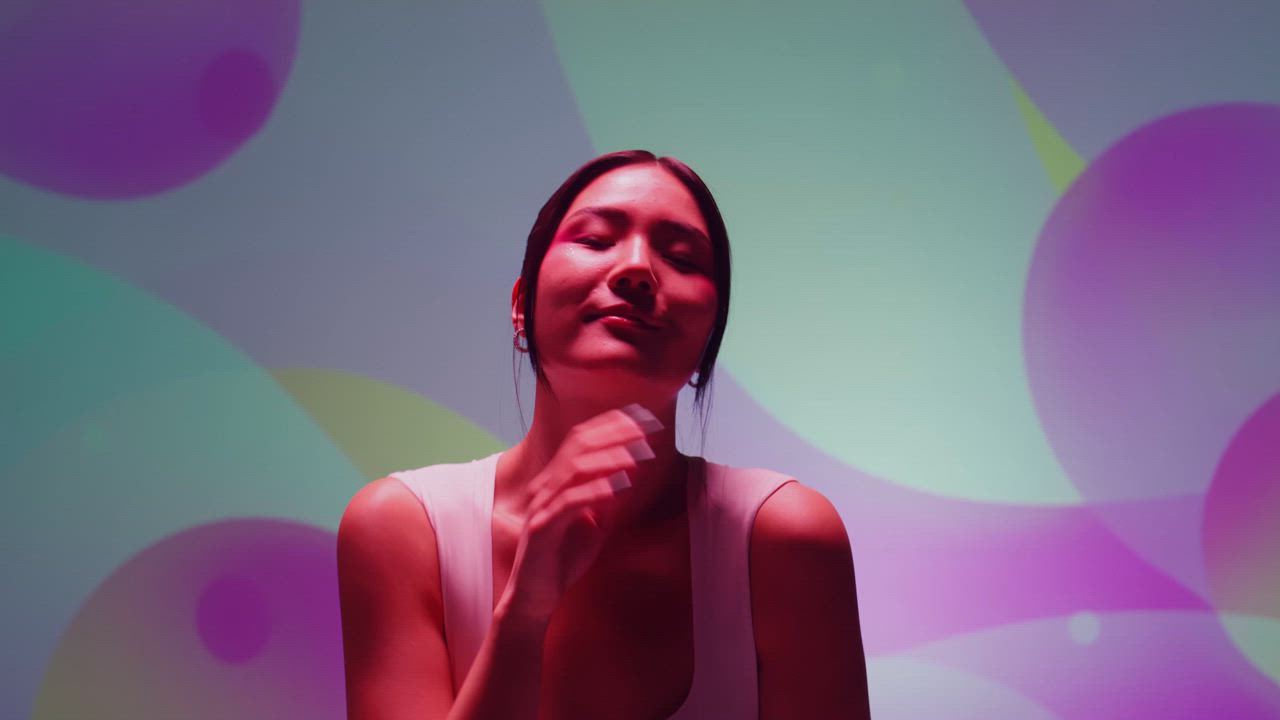 Colorful portrait of a girl modeling to the lens - Free Stock Video