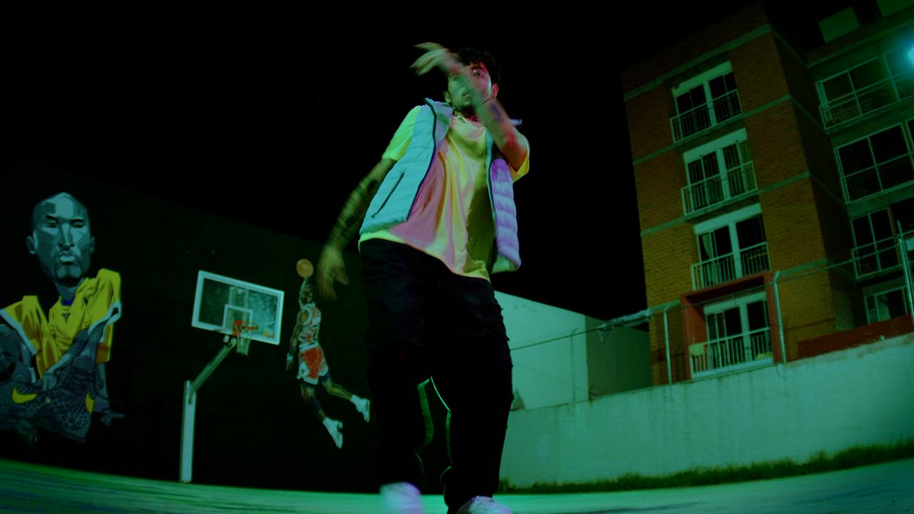 Boy dancing a choreography outside at night - Free Stock Video