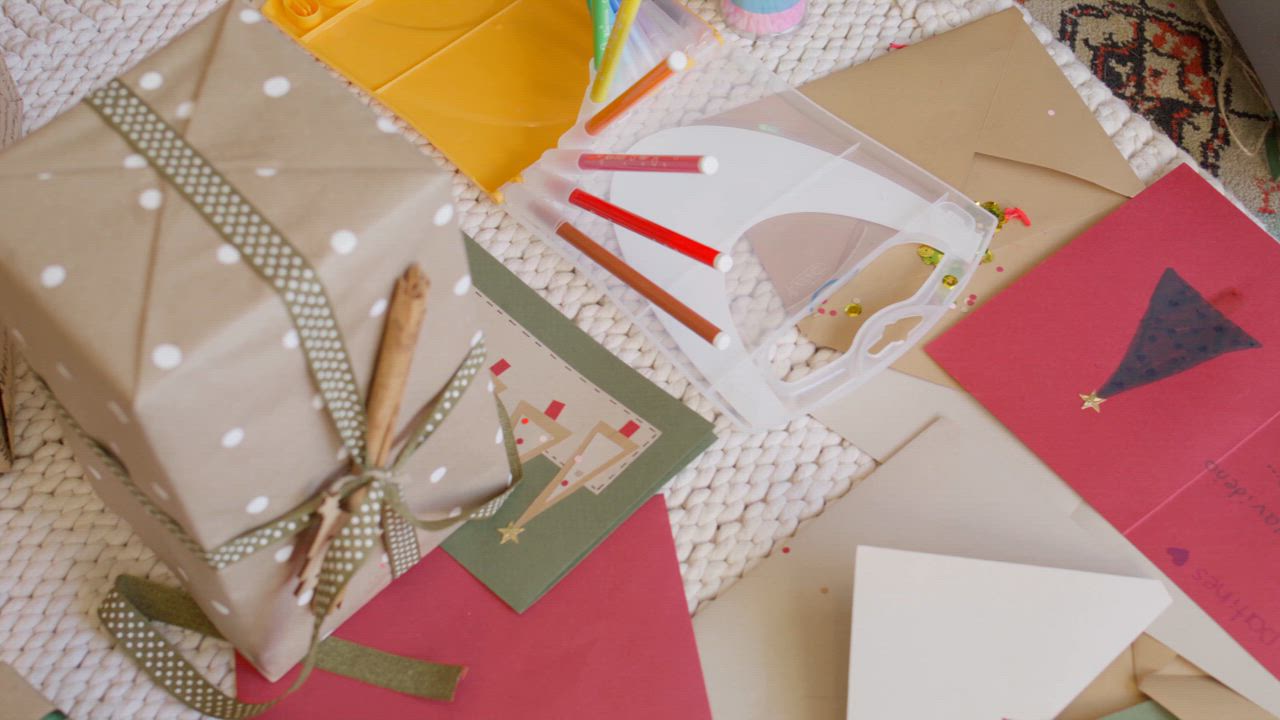 A mesmerizing scene of several hand crafted christmas cards and gifts ...