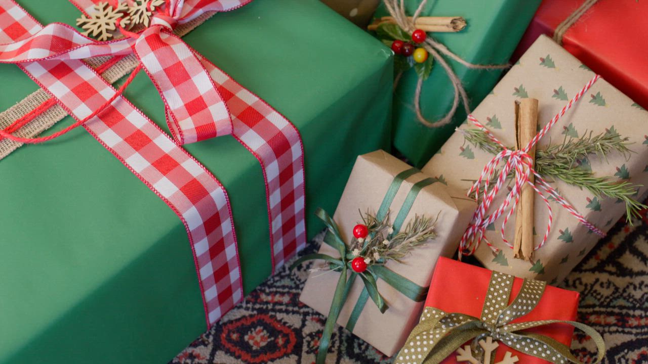 Close-up shot of beautifully wrapped gifts for Christmas - Free Stock Video
