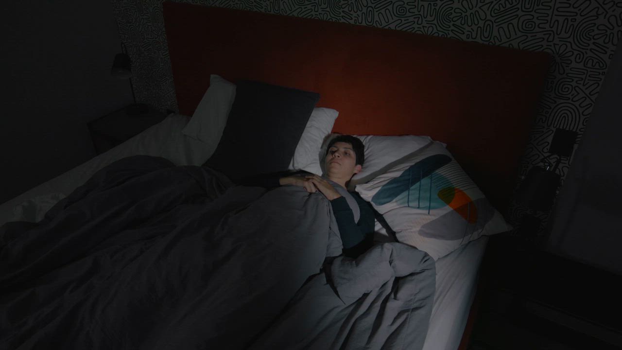 Restless woman with insomnia trying to sleep - Free Stock Video