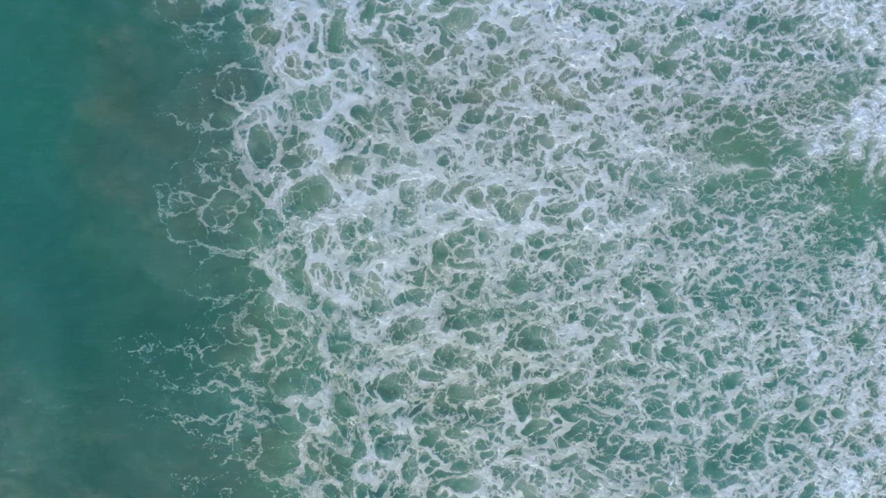 Texture of white bubbles in sea waves - Free Stock Video