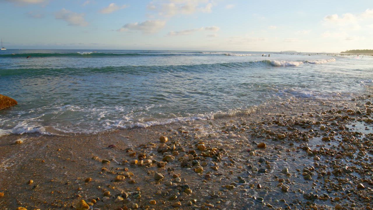 A seashore full of little rocks and the ocean waves leaving - Free ...