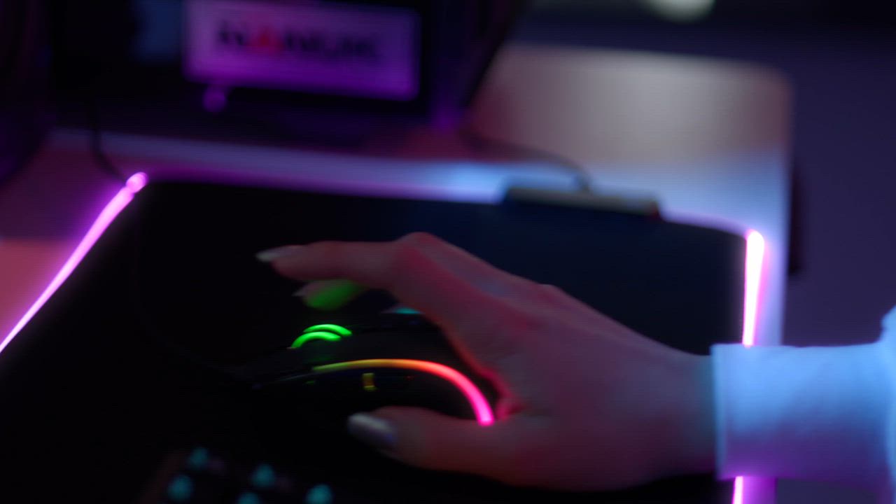 A hand moving a RGB gaming mouse in a gaming session - Free Stock Video