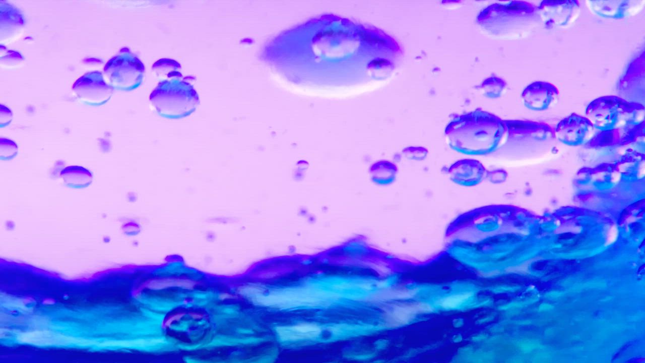 Conceptual video of the thick liquid of a lava lamp - Free Stock Video