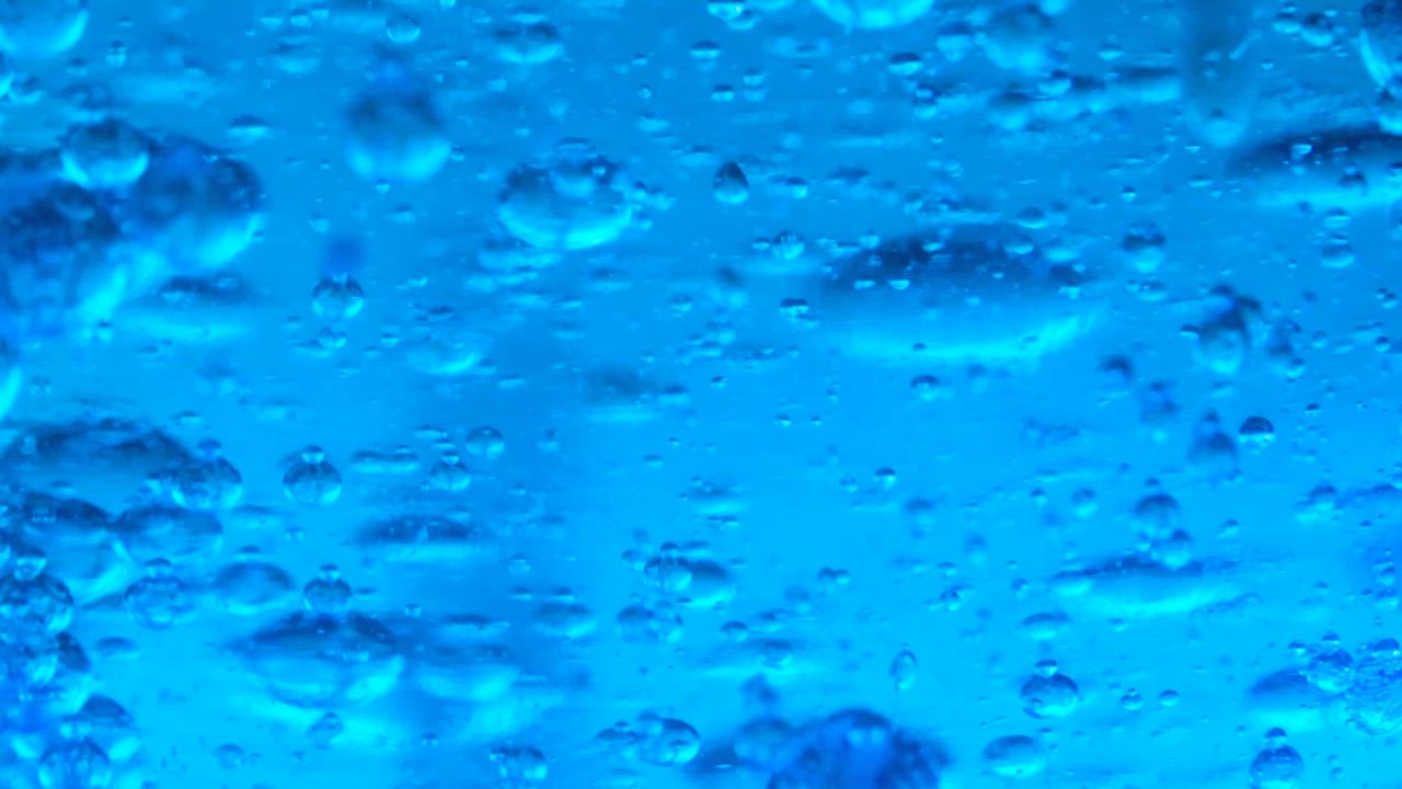 Texture of a thick blue bubbling liquid - Free Stock Video