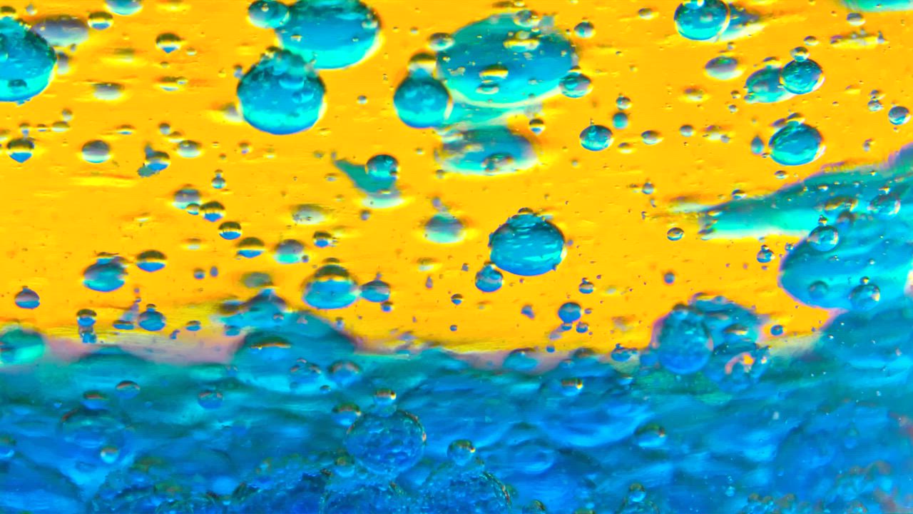 Colorful texture of a thick blue liquid - Free Stock Video