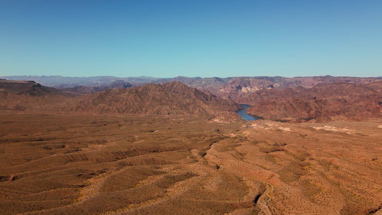 Arid and sandy mountain range in an aerial view - Free Stock Video