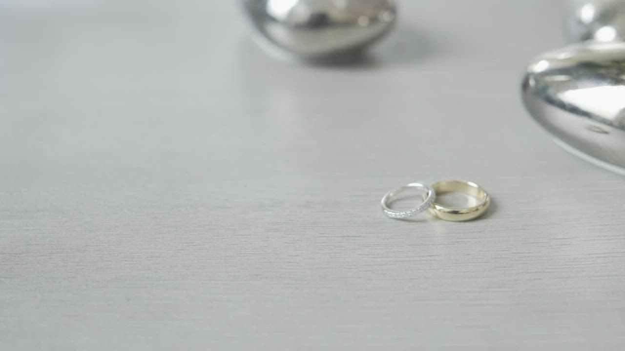 Engagement rings on a wedding table - Free Stock Video