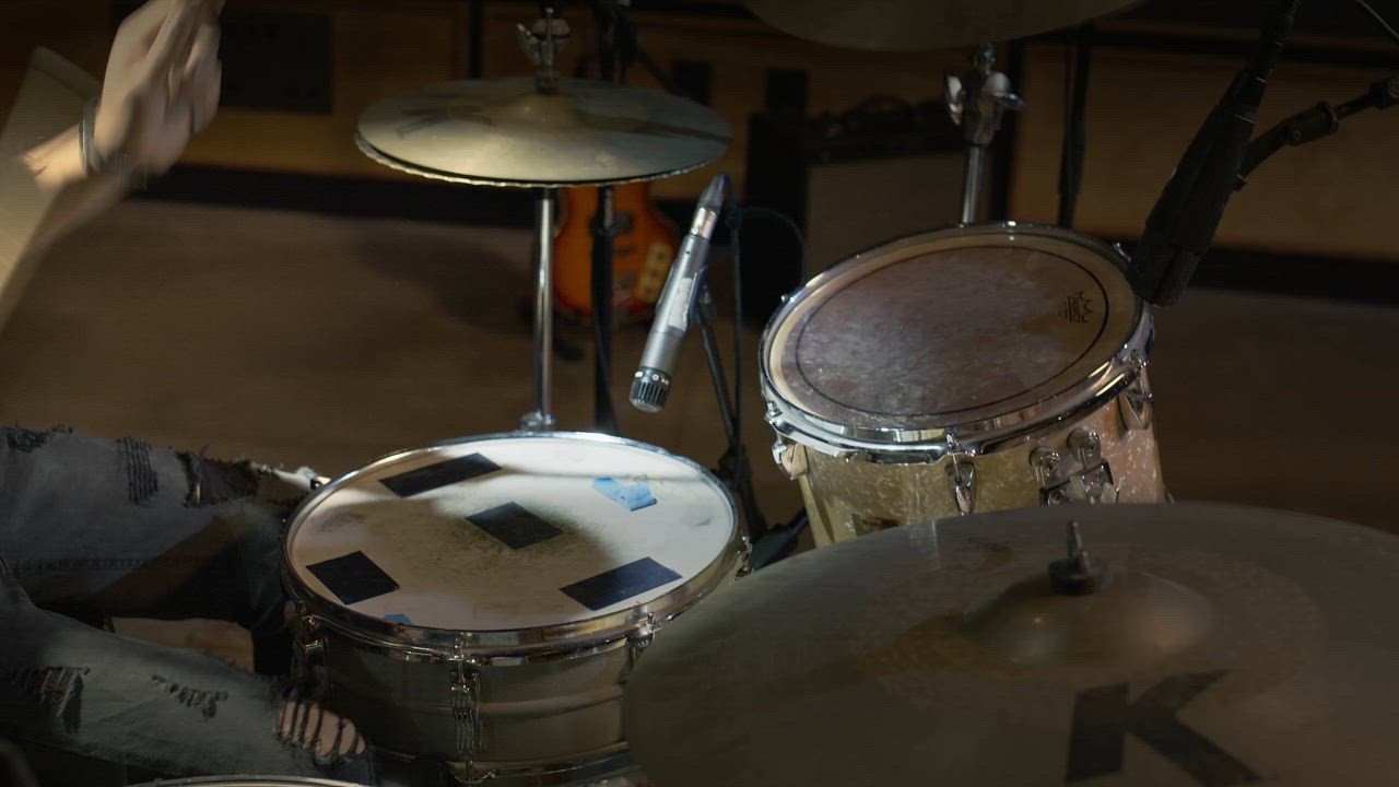 Close up shot of a long haired drummer playing in a studio - Free Stock ...