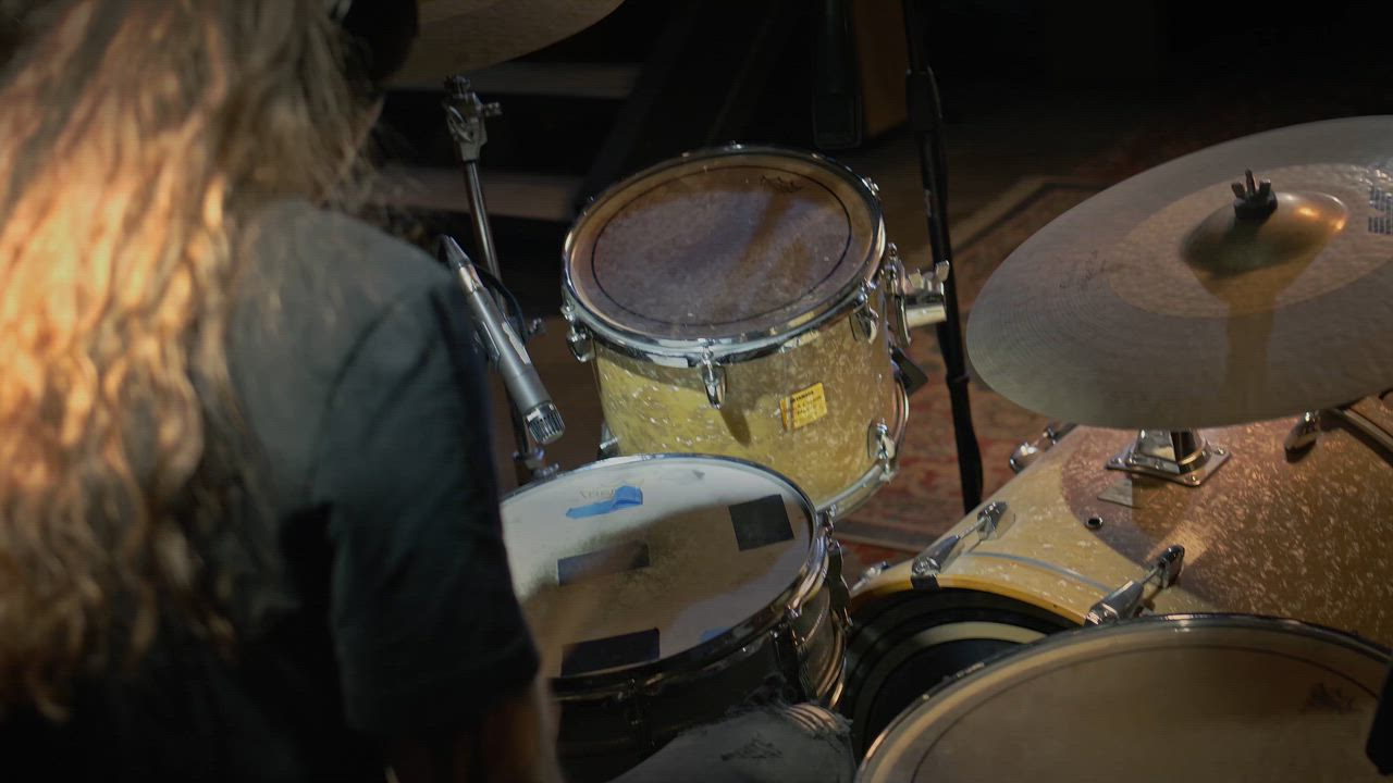 Talented drummer in a studio seen from behind - Free Stock Video