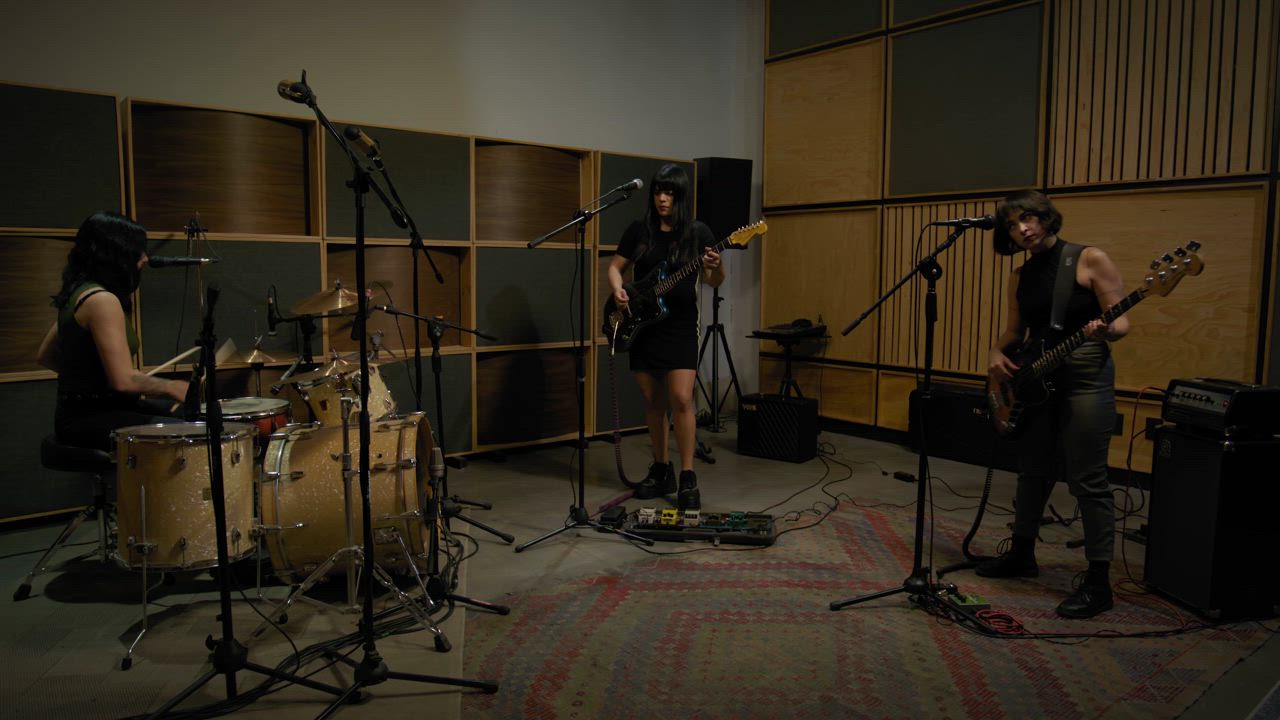 Three girls band playing music in a recording studio - Free Stock Video