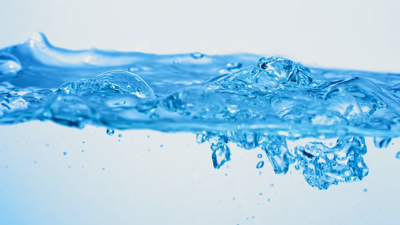 Water bubbling in slow motion on white background - Free Stock Video