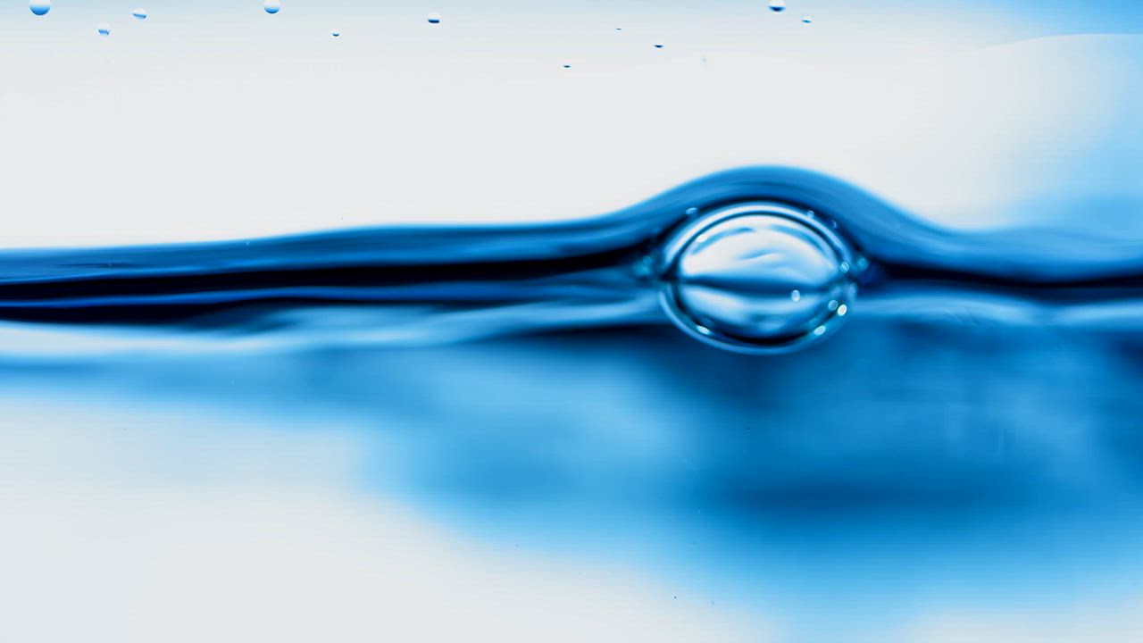 Small bubble on rippling water surface - Free Stock Video