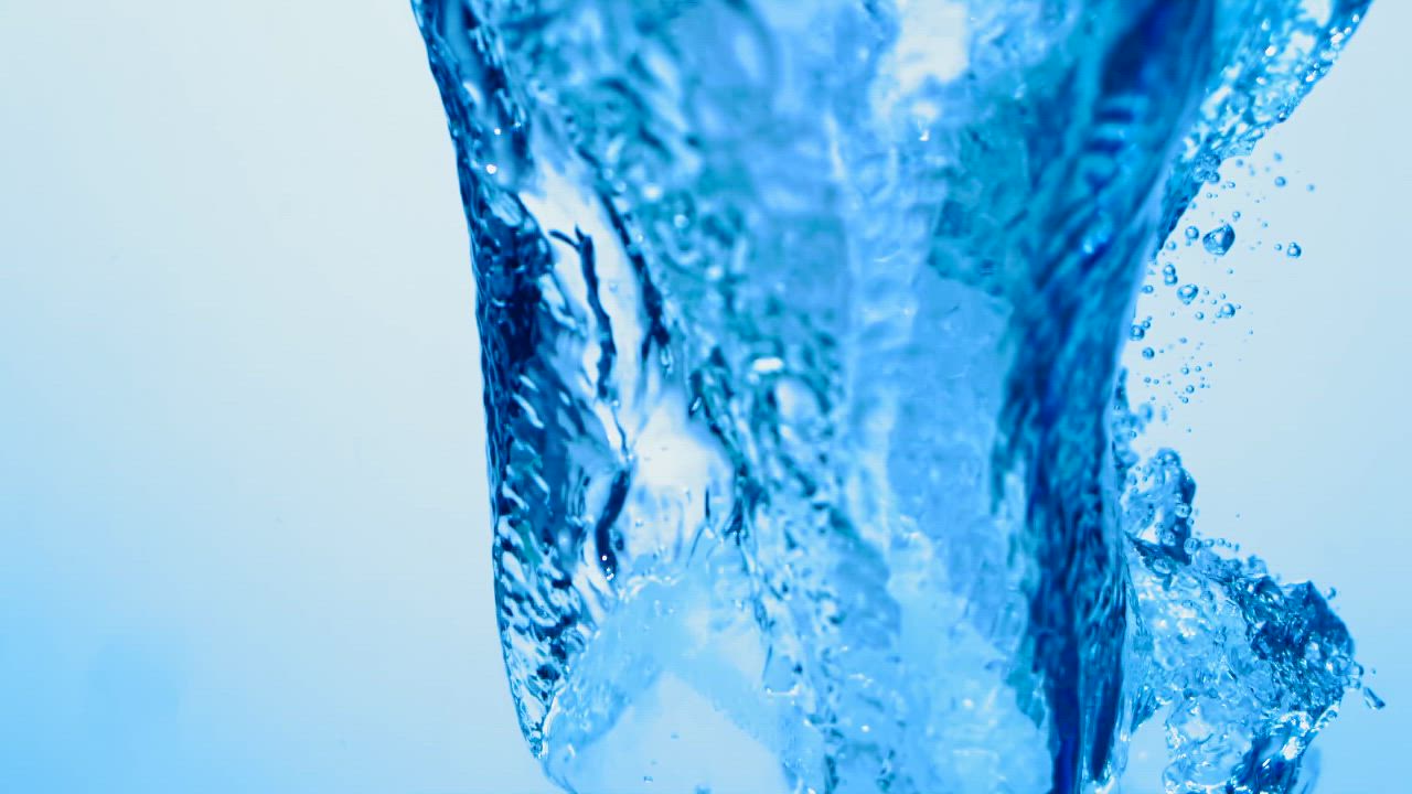 Swirl in water after an ice fell, in slow motion - Free Stock Video