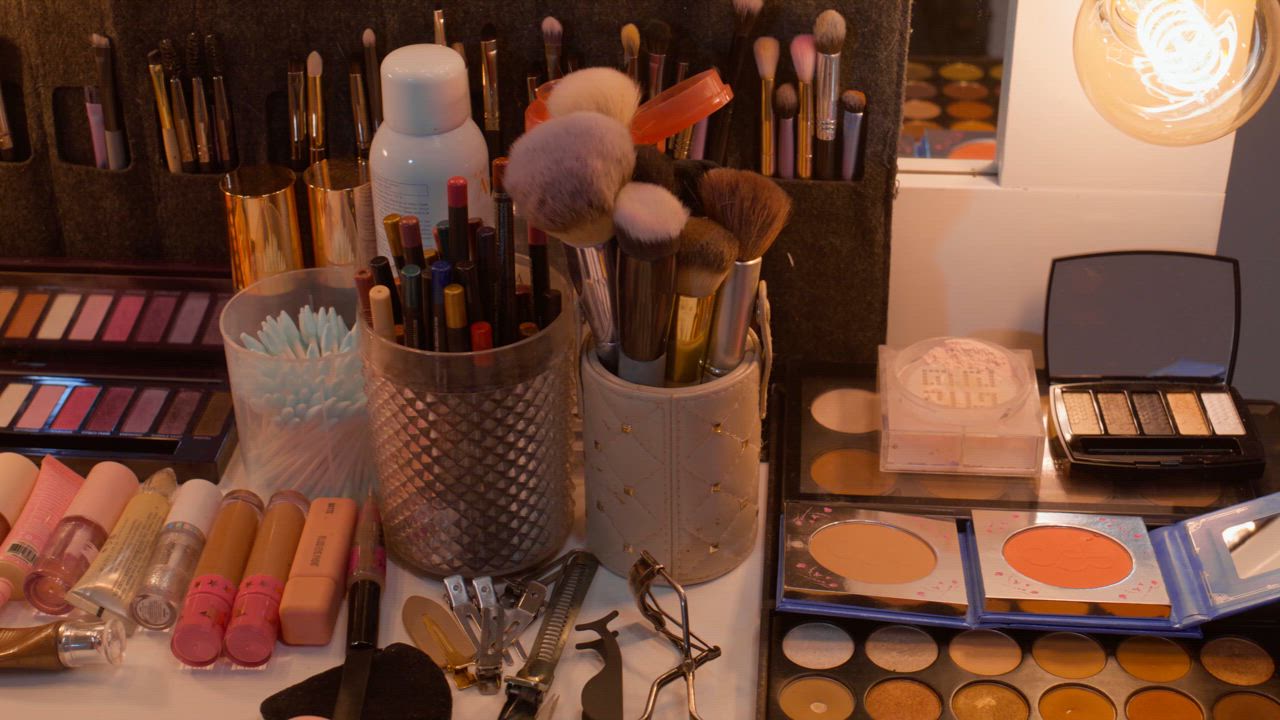 A complete and colorful set of makeup tool neatly arranged on the table ...